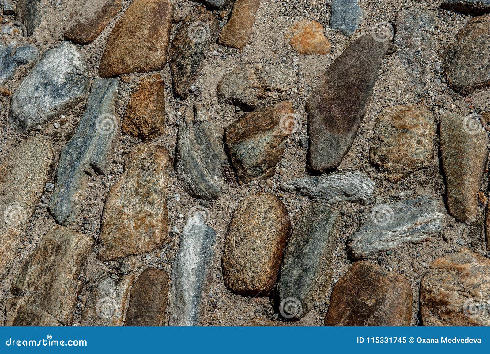 Background of Natural Multi-colored Stone on a Plain Textured Wall with ...