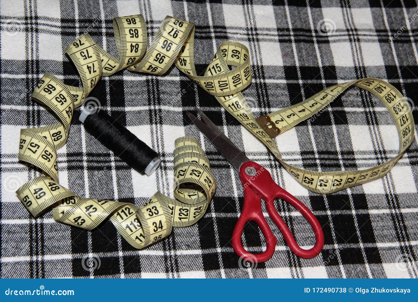 Background for Needlework. on the Checkered Fabric Scissors with ...