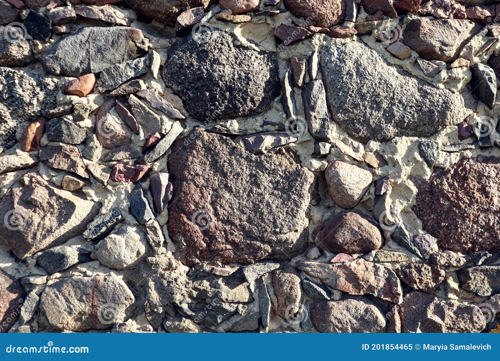Background of an Old Stone Wall Made of Various Types of Stone with ...