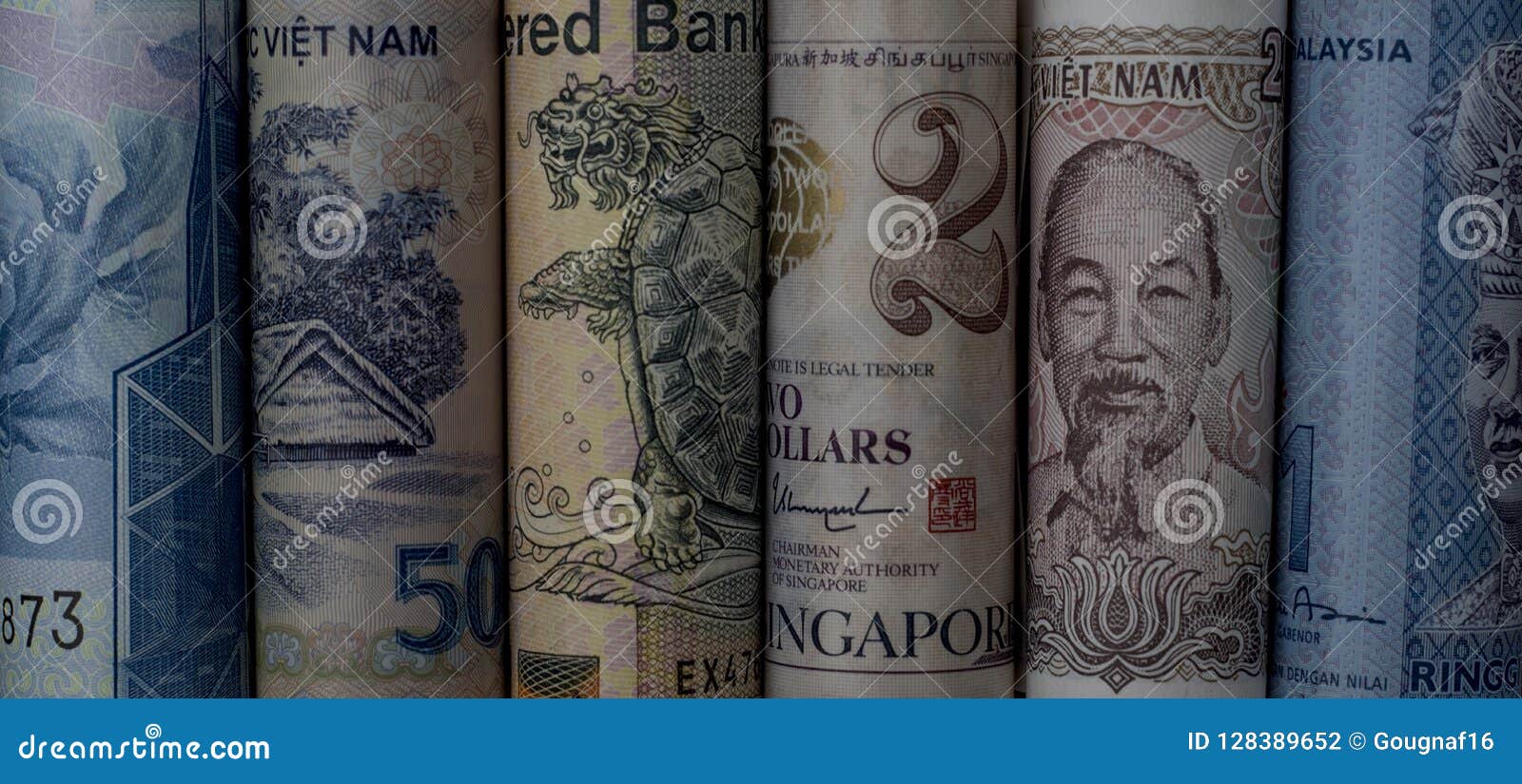 Rolled Asian money notes. stock photo. Image of banking - 128389652