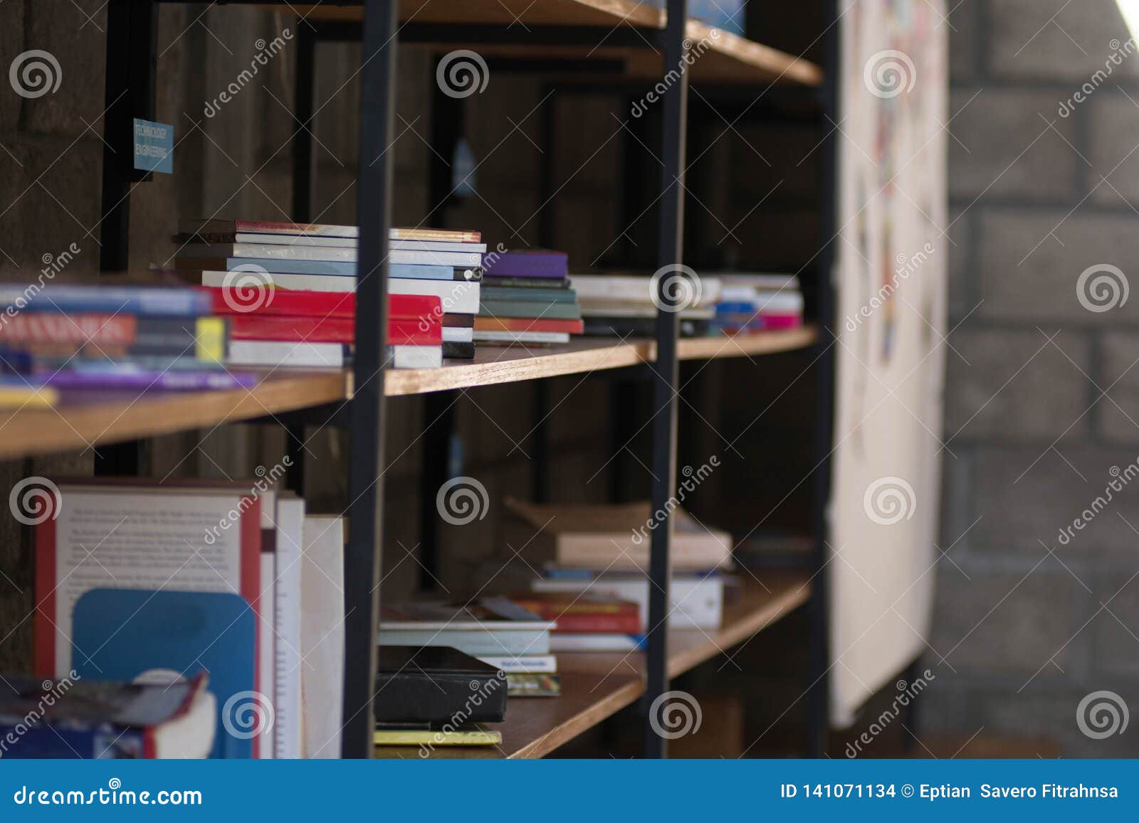 Side View with Copy Space Pile of Books in Wooden Rack at a Modern ...