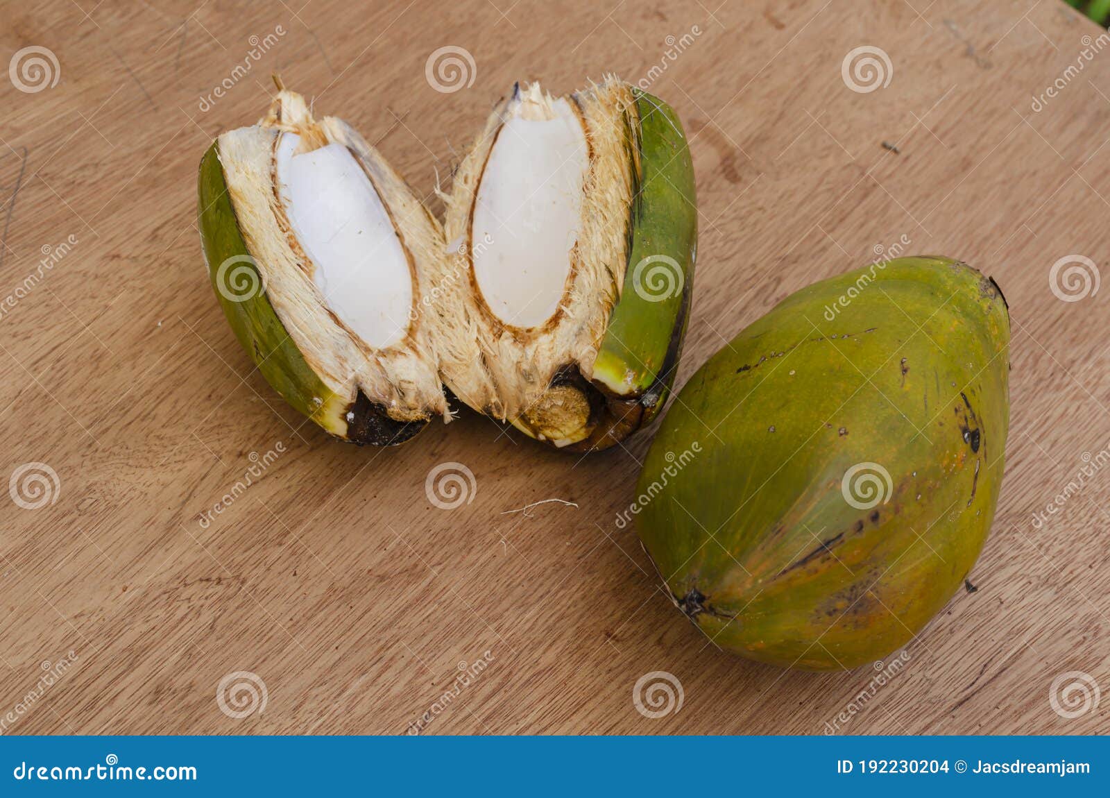 Cut and Whole Coconuts stock photo. Image of husk, arecaceae - 192230204