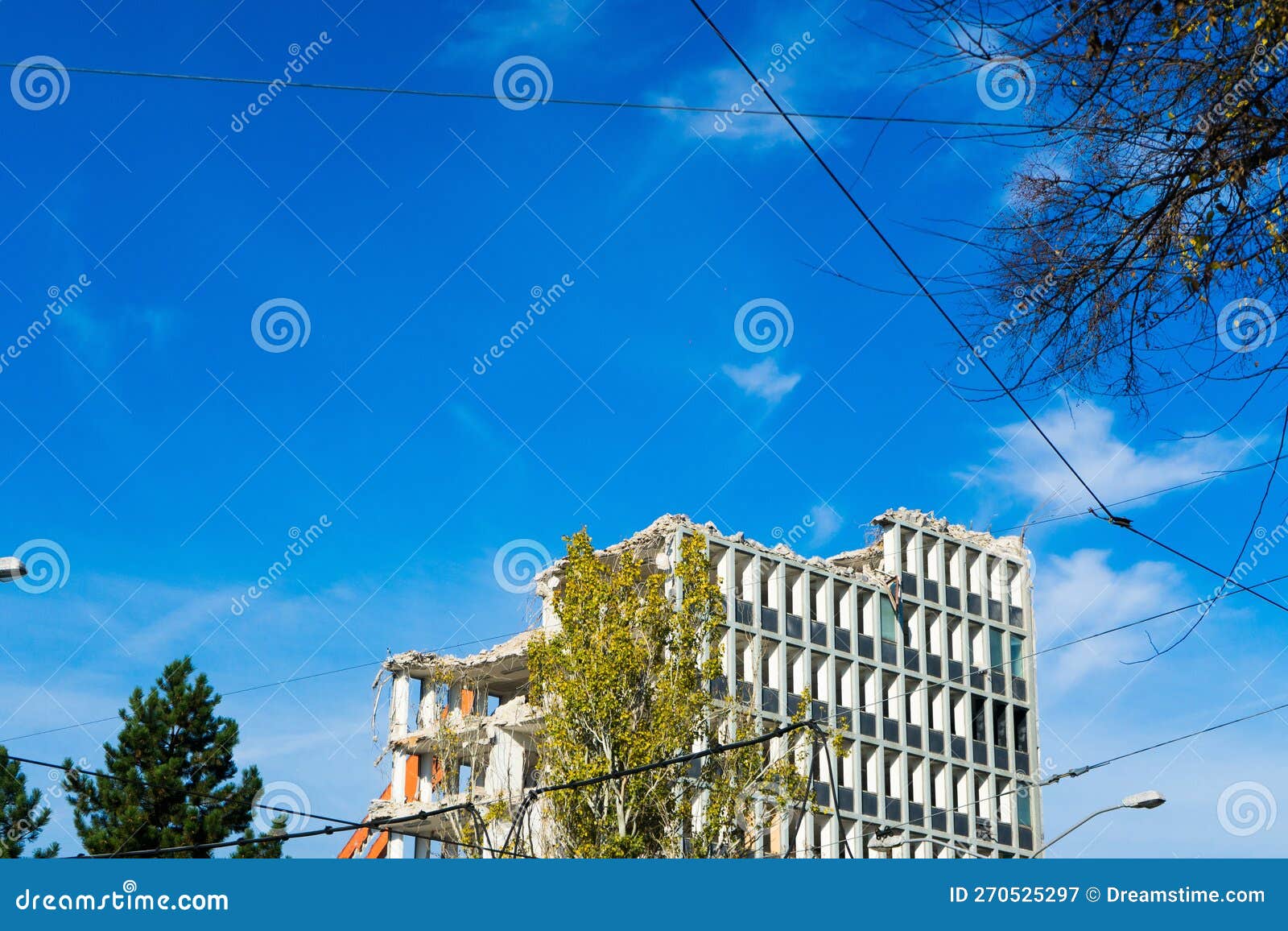Background of Process of Demolition of Building. Excavator Breaking Old ...