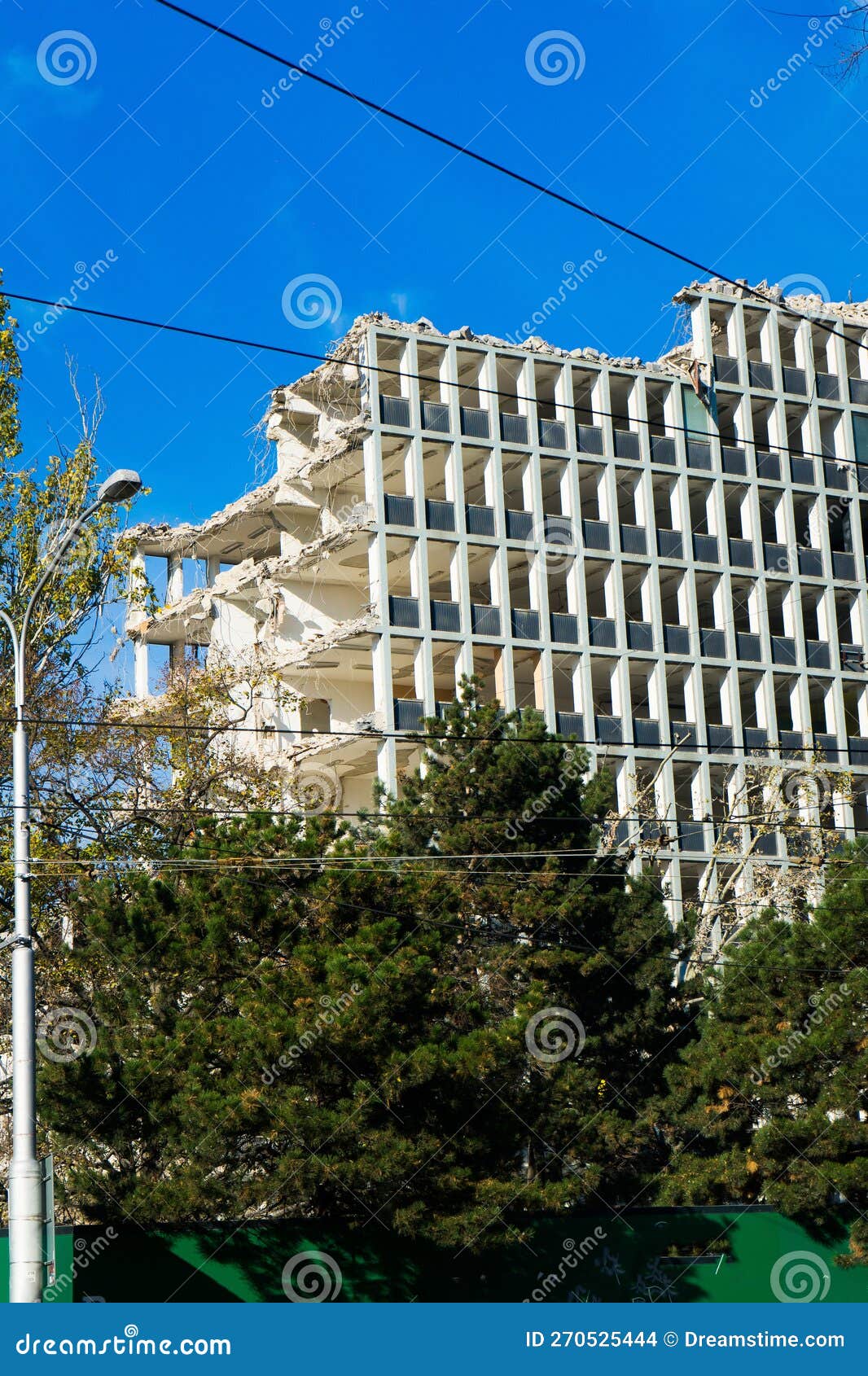 Background of Process of Demolition of Building. Excavator Breaking Old ...