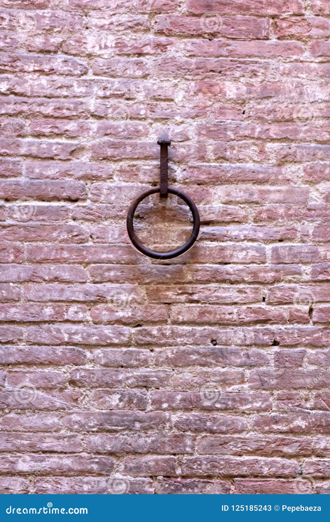 Rusty ring on a brick wall stock image. Image of bricks - 125185243