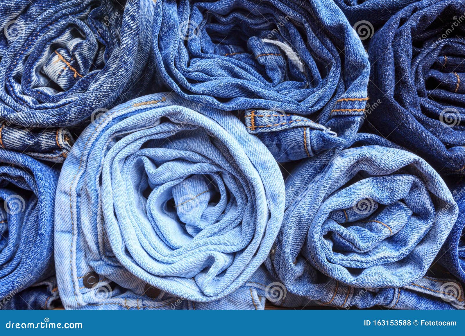 Background of a Stack Rolled Jeans Vintage - Image Stock Photo - Image ...