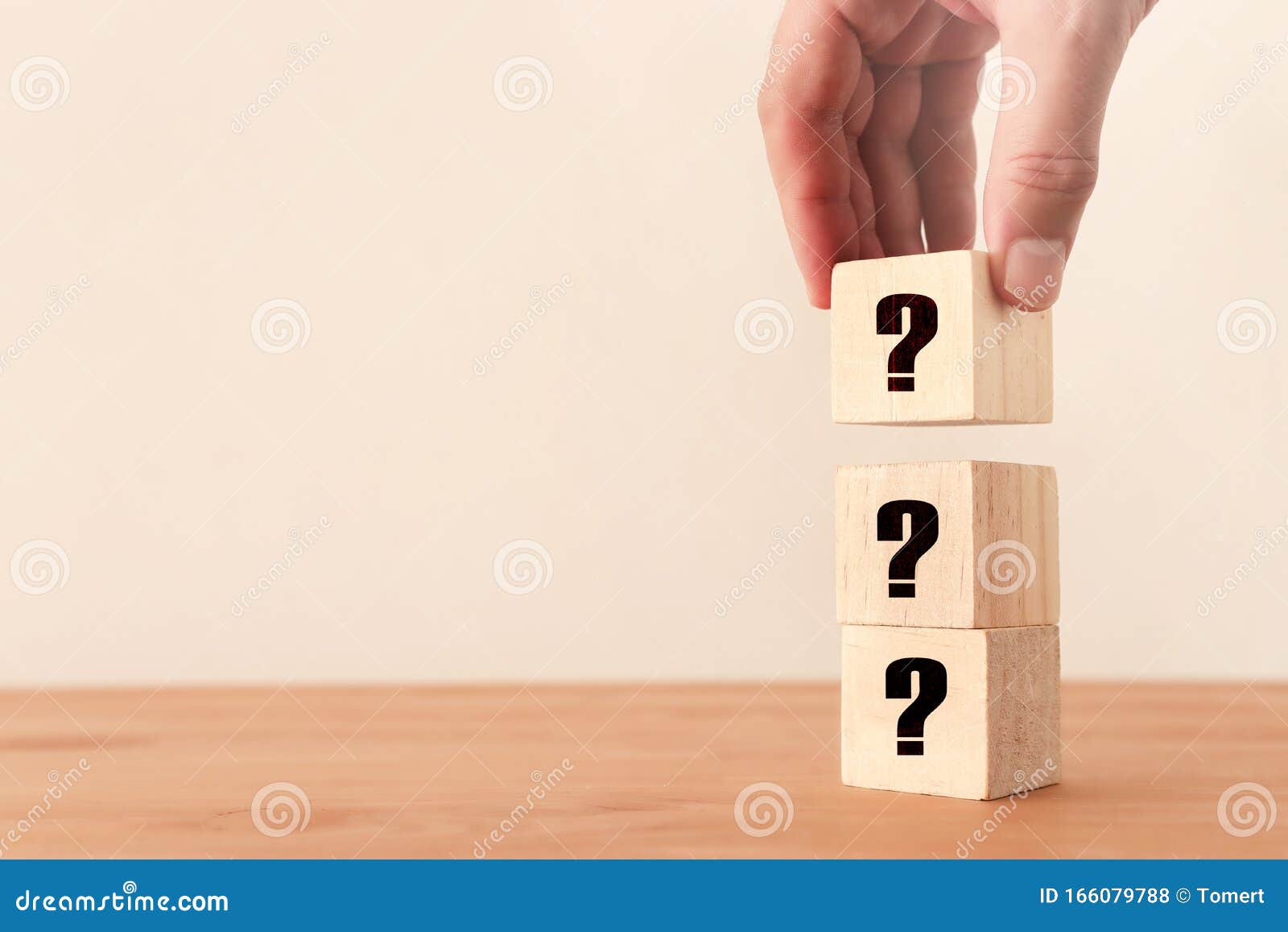 Background of a Stack of Wooden Blocks with a Question Mark Symbol on a ...