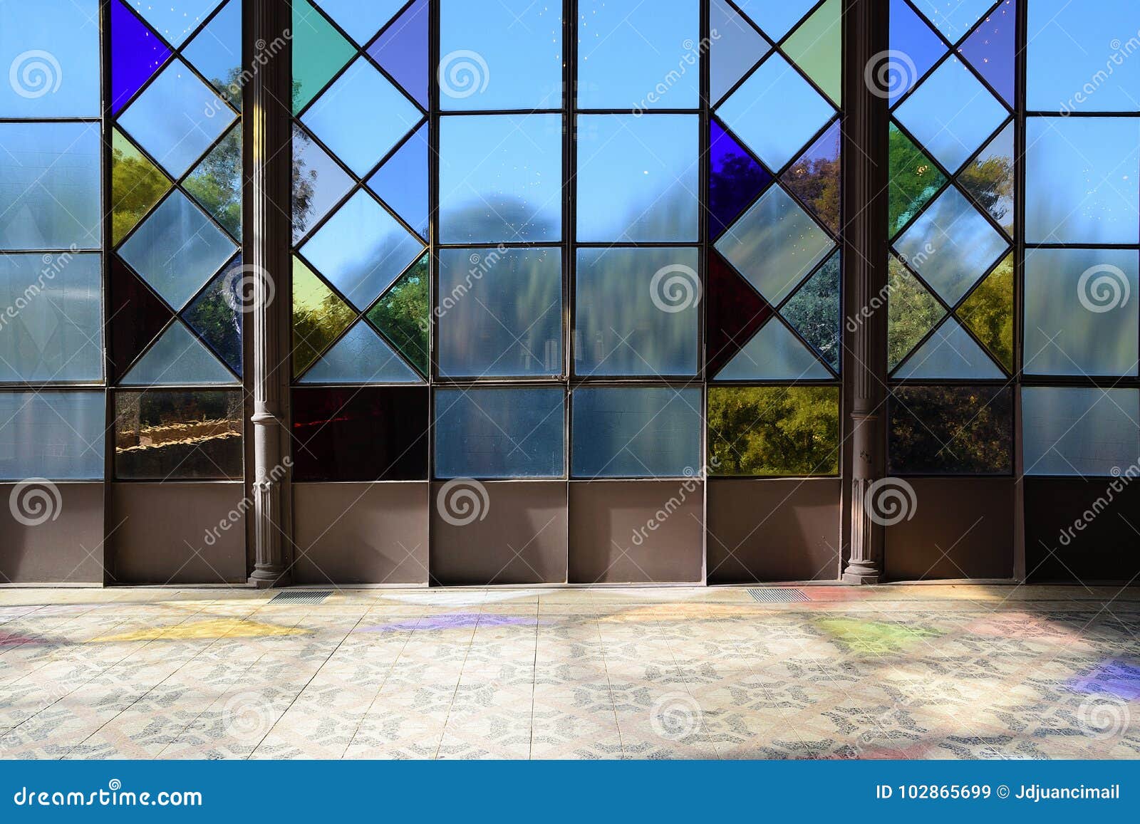 Background with Stained Glass Wall in a Room and Hydraulic Pavement ...