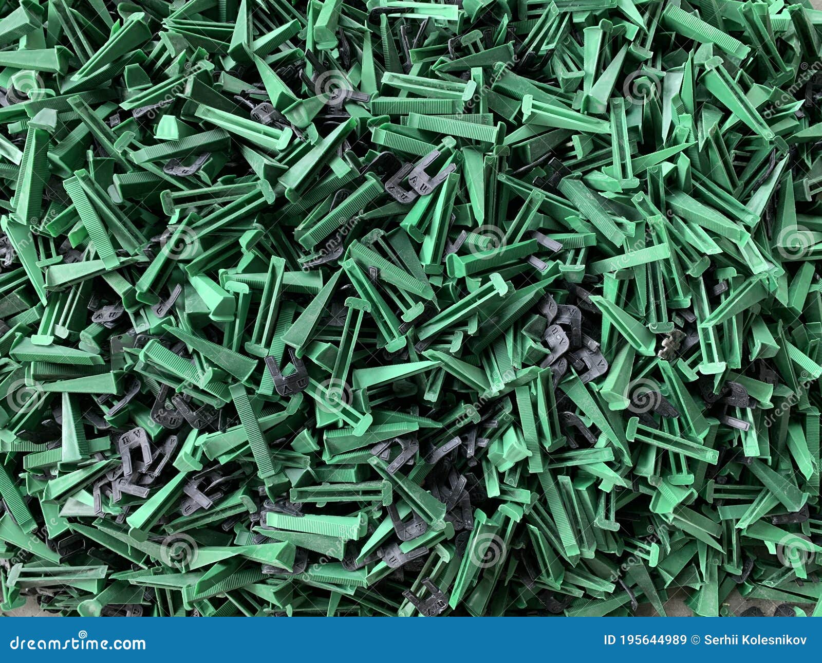 Background Texture: Plastic Spacers for Ceramic Tiles. Green Plastic ...