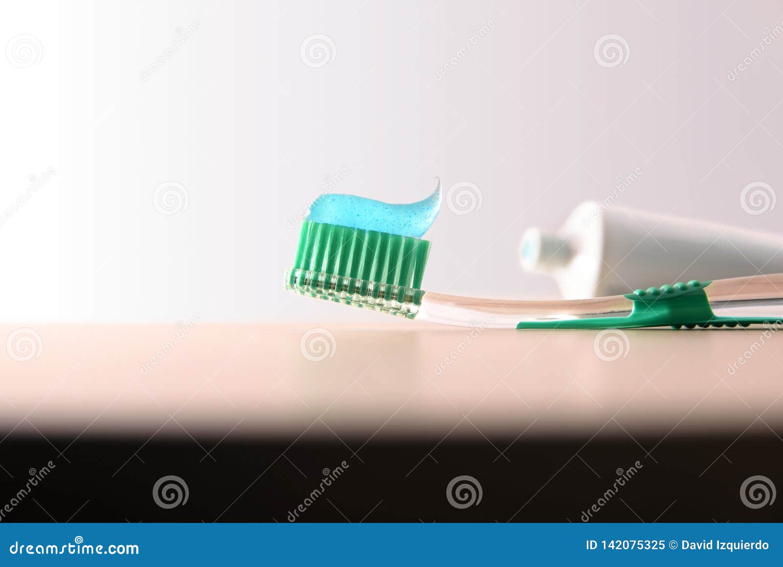 Background with Toothbrush and Toothpaste on Wooden Table Front View ...