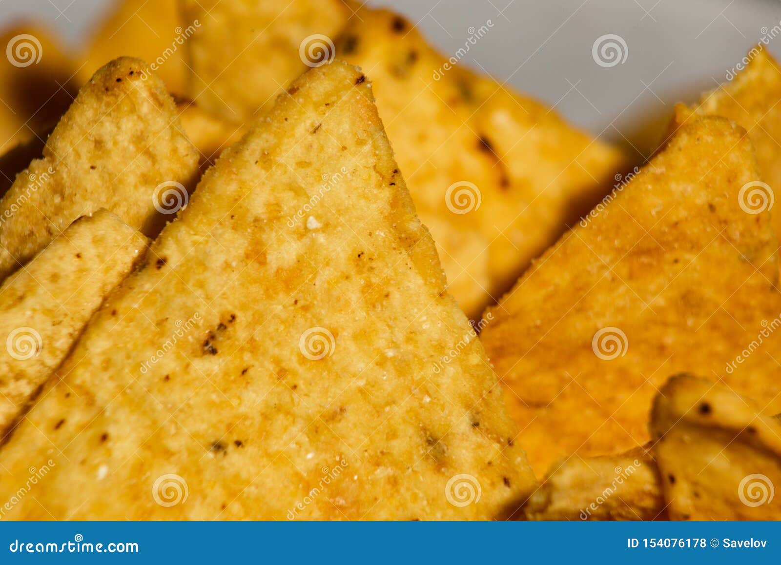 Background of Triangular Nachos is Close Stock Photo - Image of salt ...
