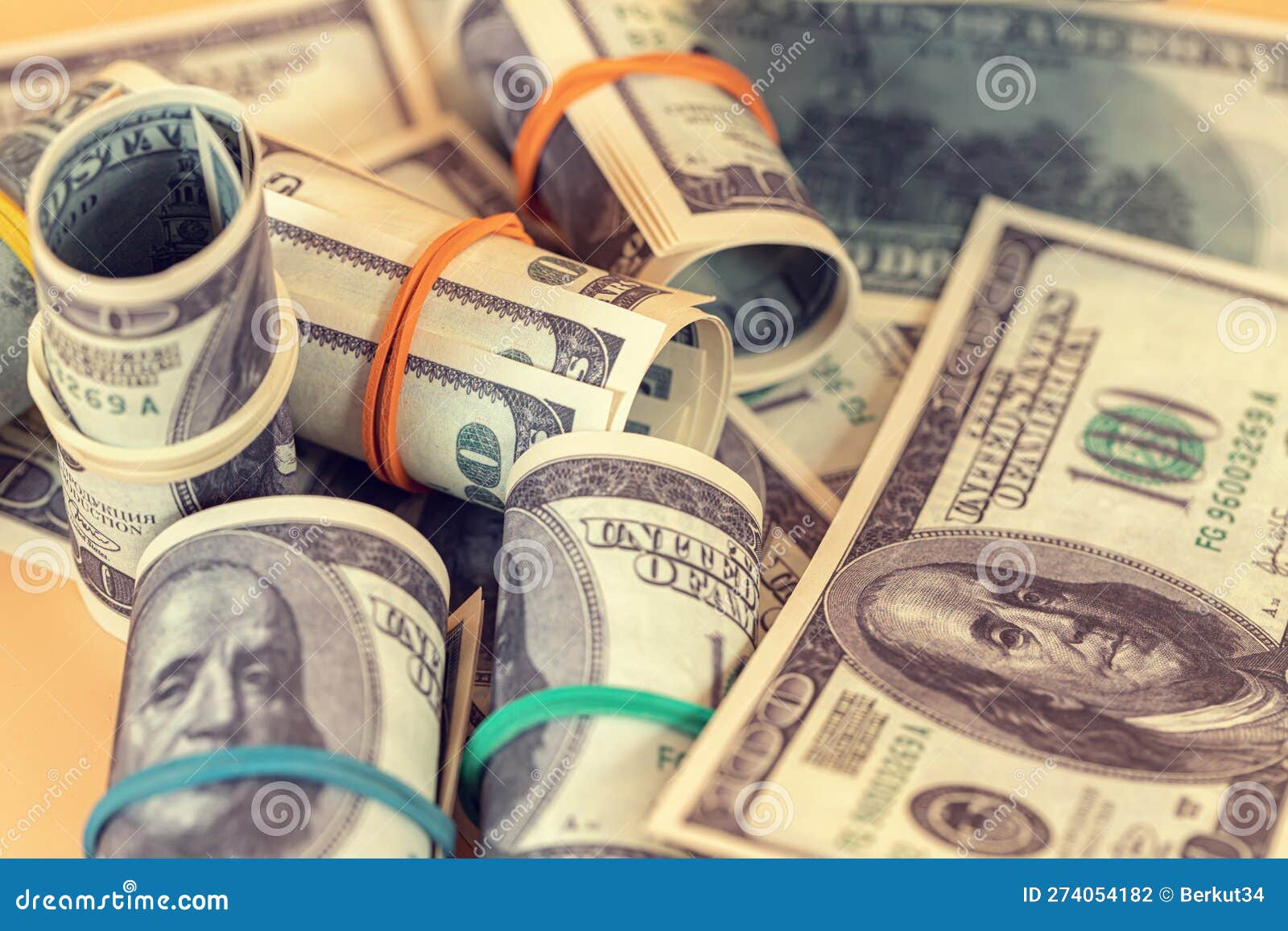 Background of Twisted Hundred Dollar Bills on the Table Stock Photo ...