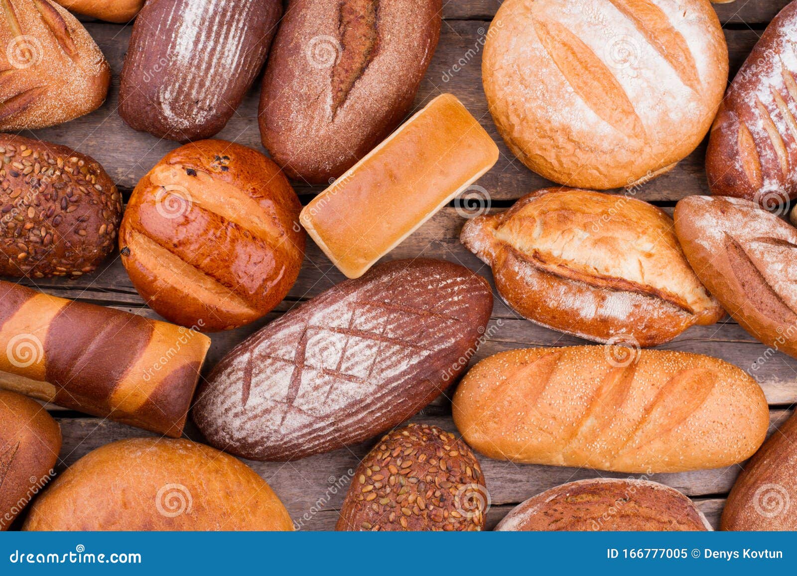 Loaves Of Different Types Of Bread In Wheat Field. Assortment Of Bread ...