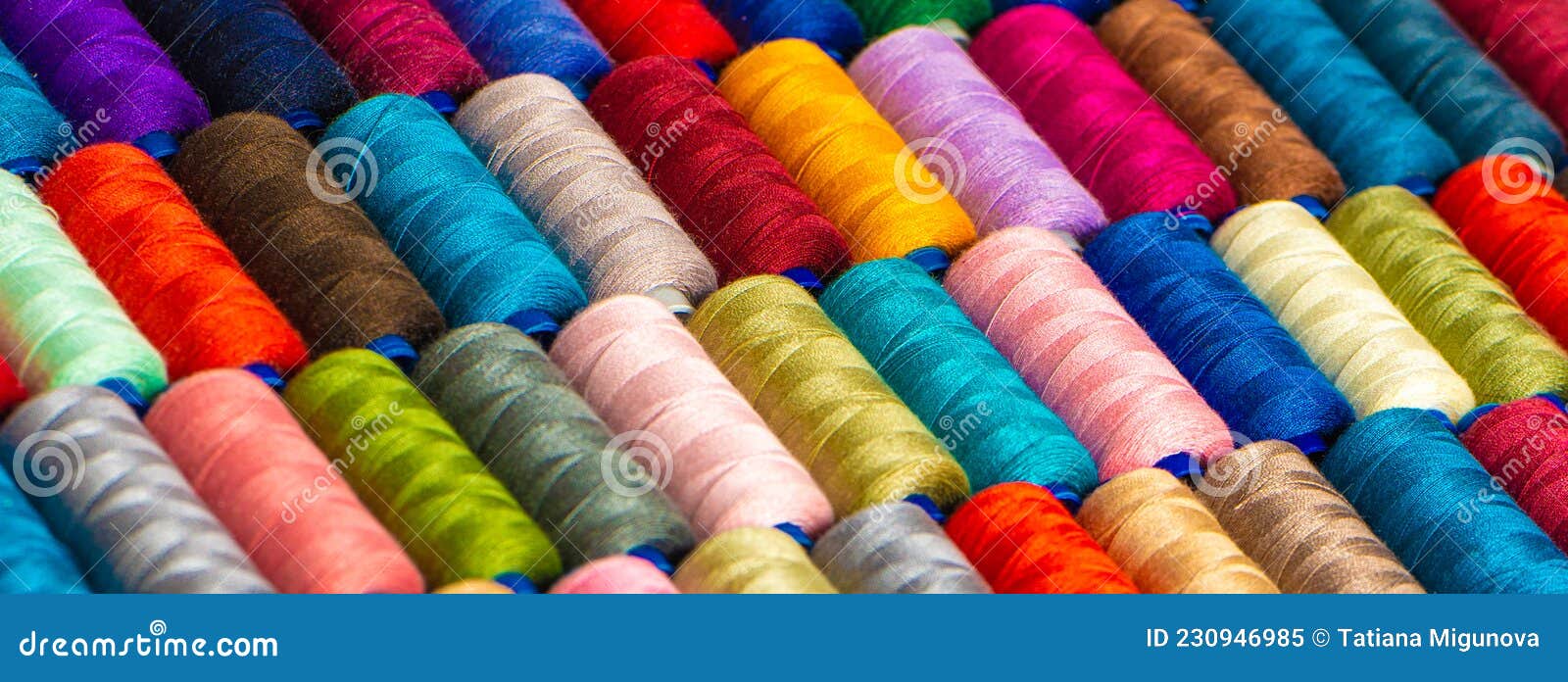 Multi-colored Sewing Threads Laid Out in a Row. Bright Background ...