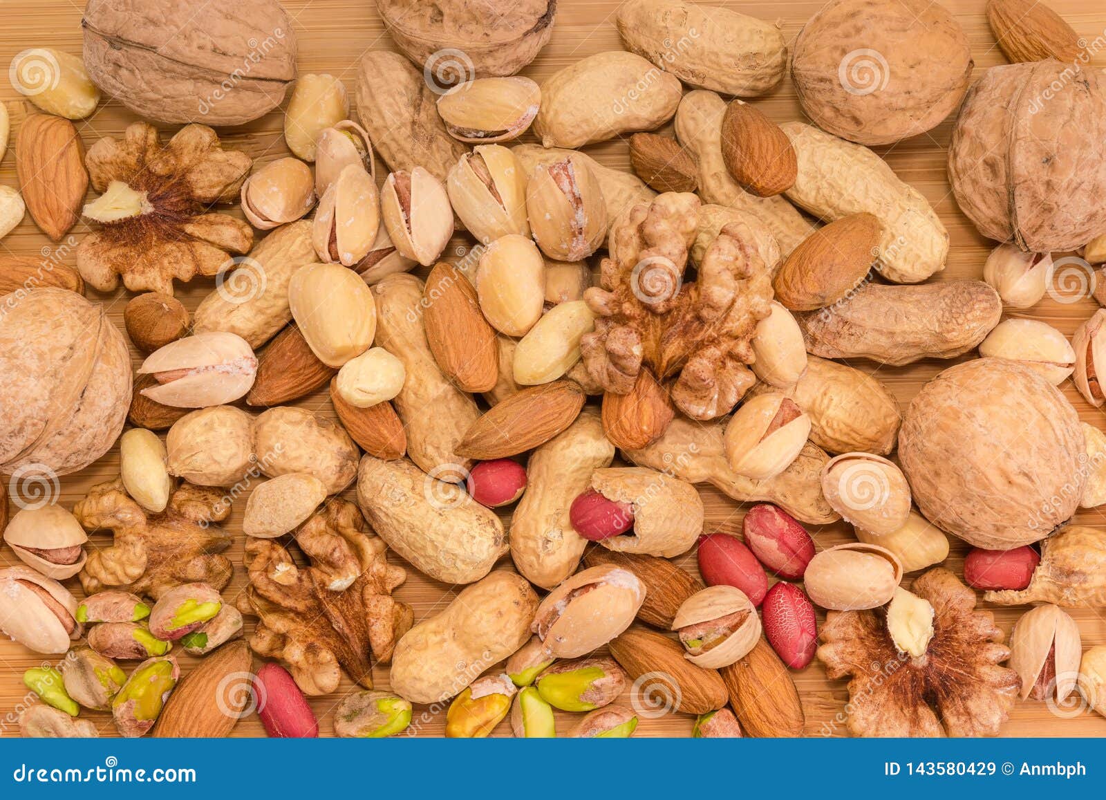 Background of the Various Nuts on a Wooden Surface Stock Image - Image ...