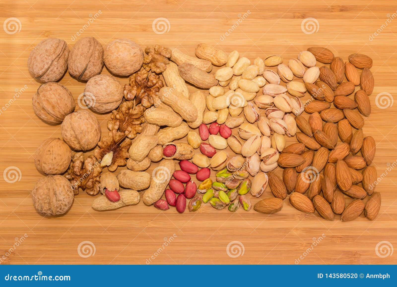 Background of the Various Nuts on a Wooden Surface Stock Photo - Image ...