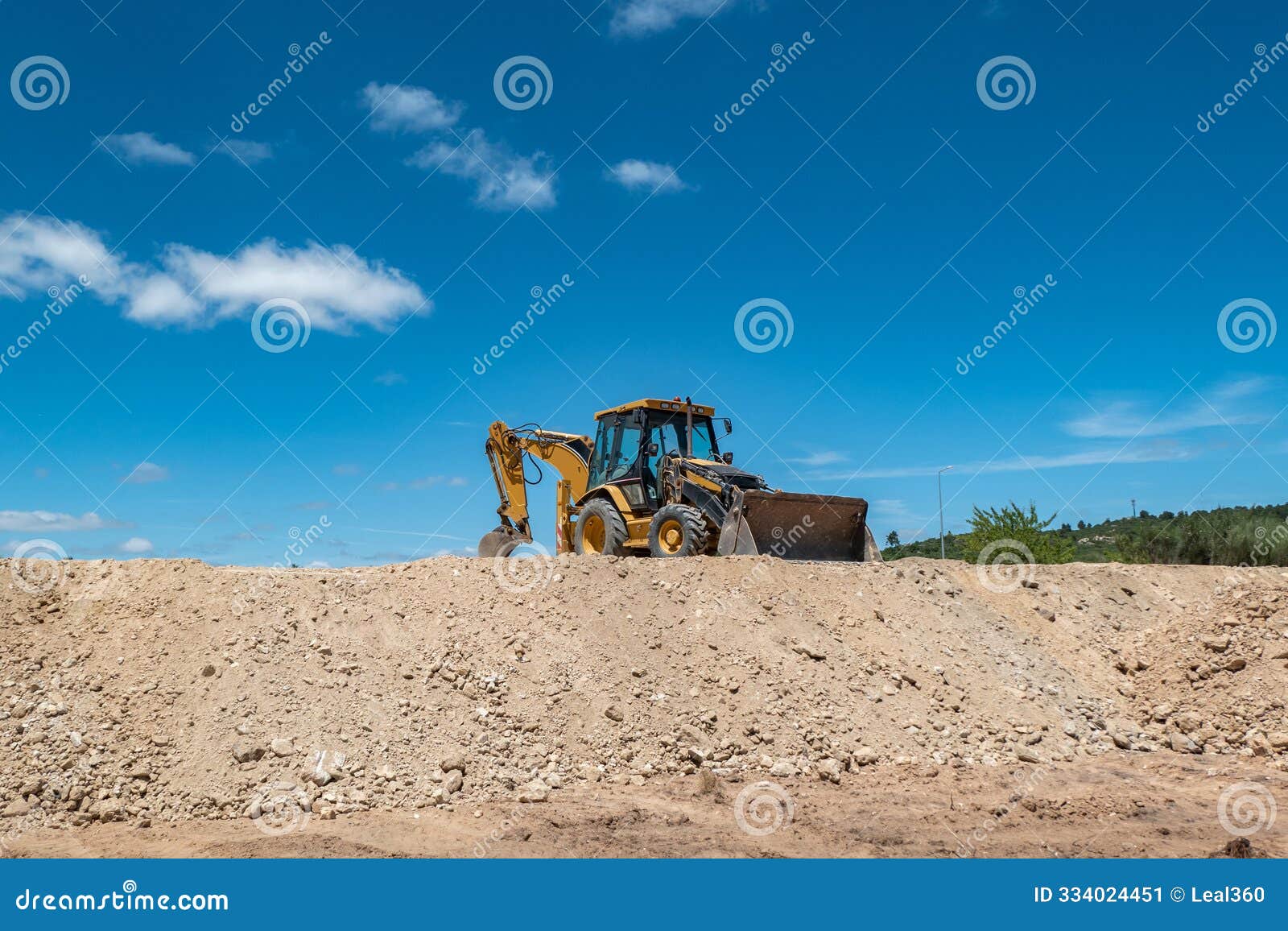 Backhoe in Action Spreading Land for Batch Construction Stock Image ...