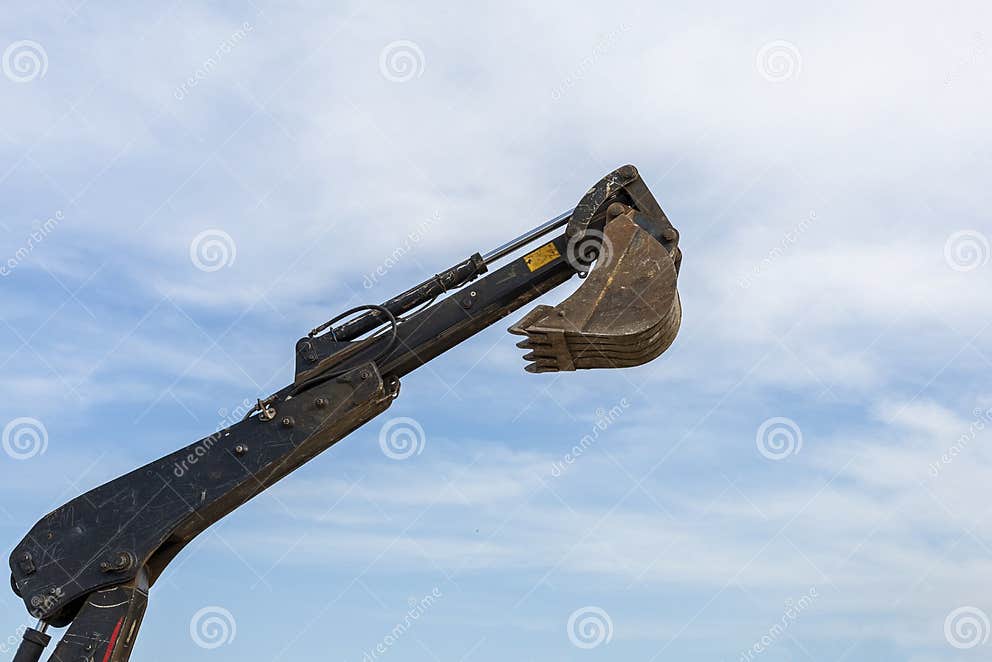 A Backhoe Bucket As a Rising Graph Line Stock Photo - Image of bucket ...