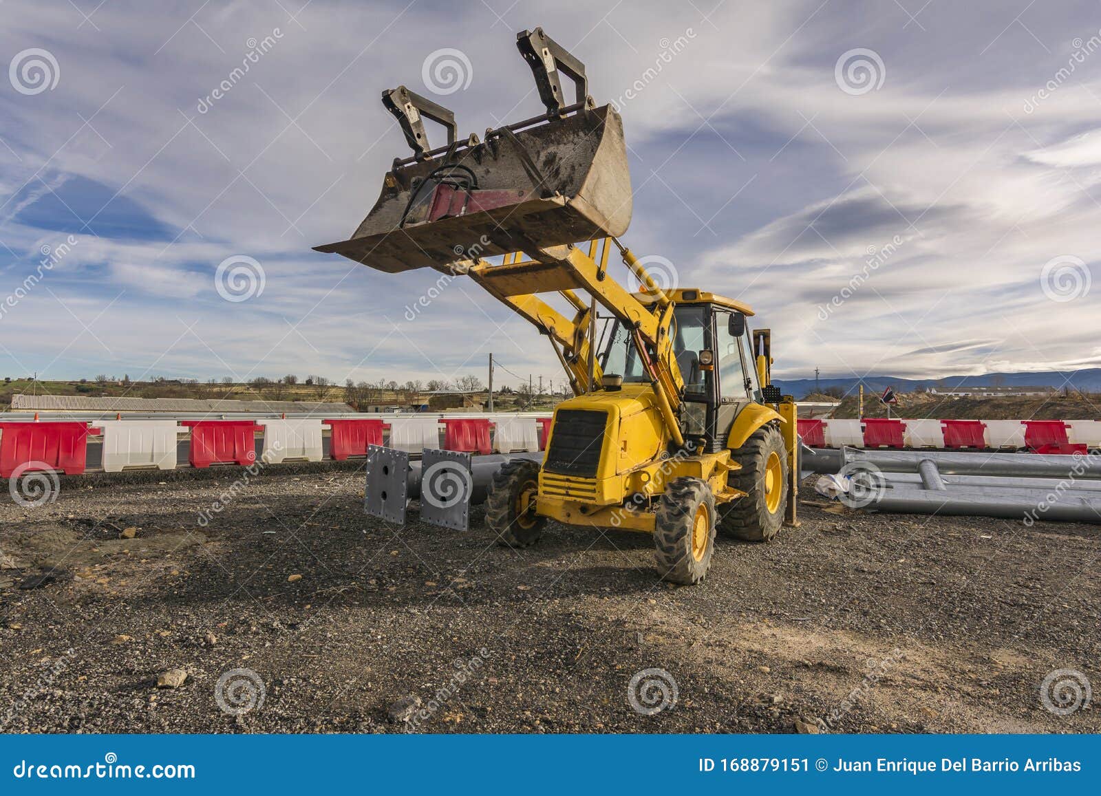 Backhoe In Construction Tasks Of A Road. Preparation Of The Land For ...
