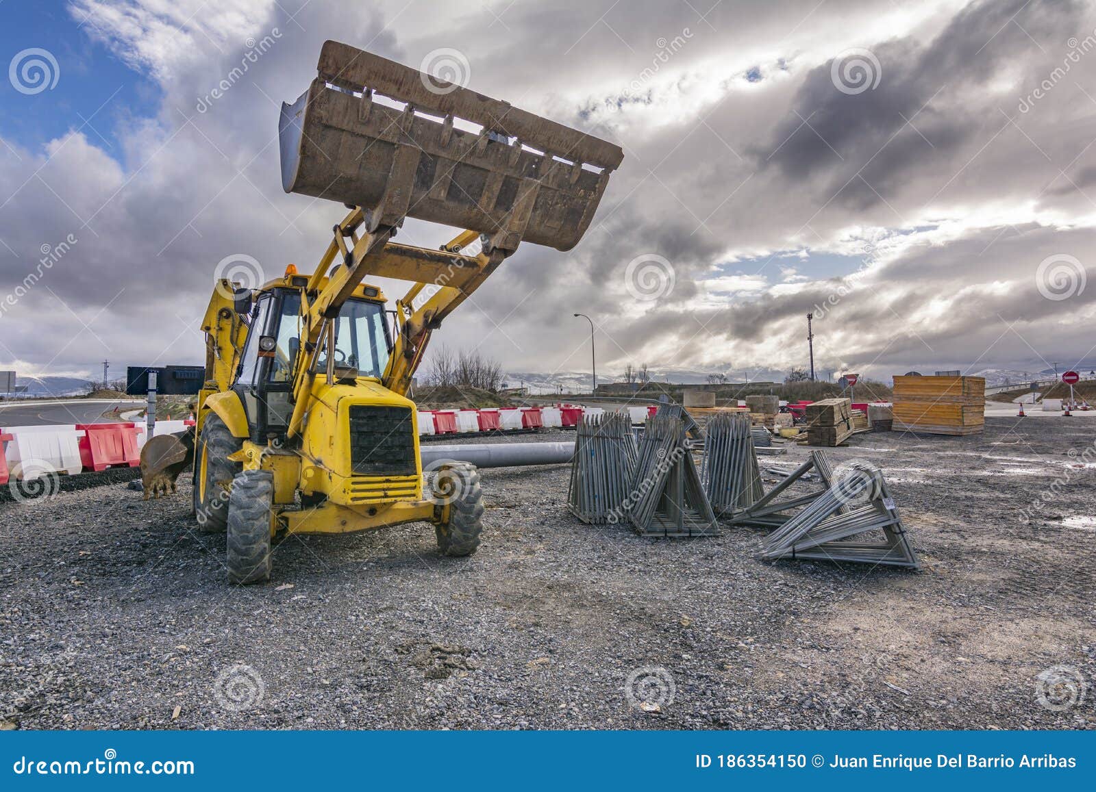 Backhoe In Construction Tasks Of A Road. Preparation Of The Land For ...