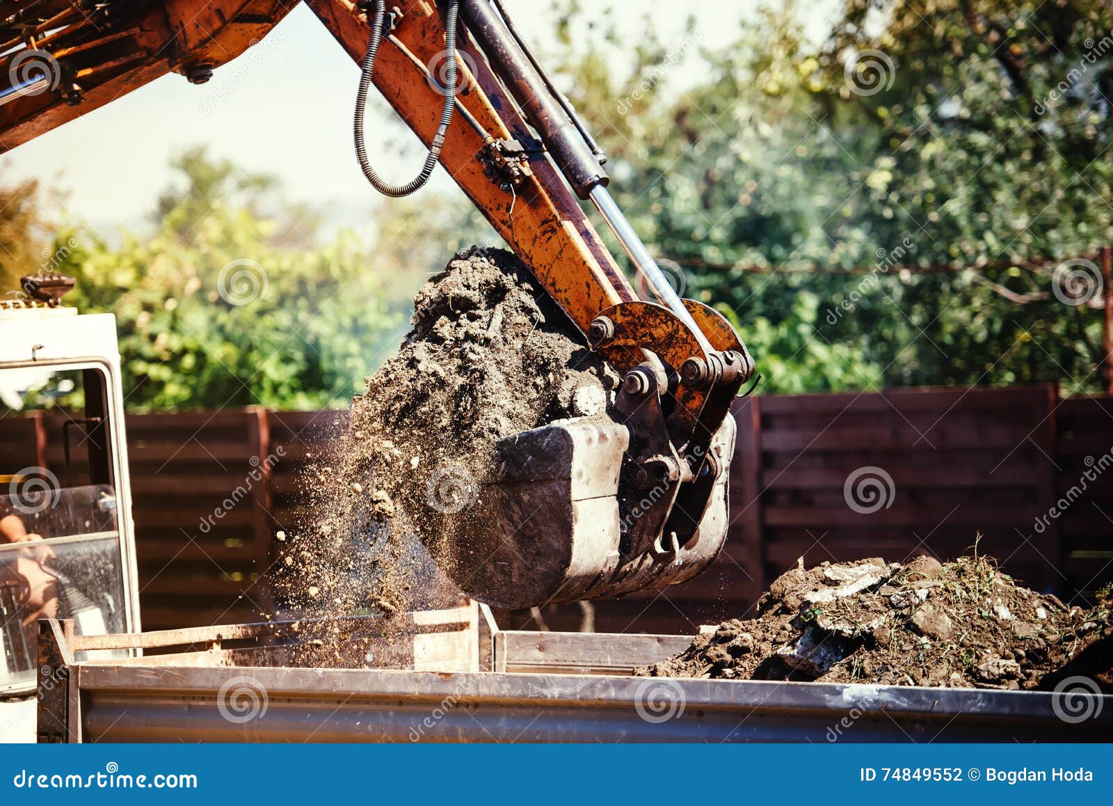 Backhoe Excavator Scoop Loading From Building In The Construction ...