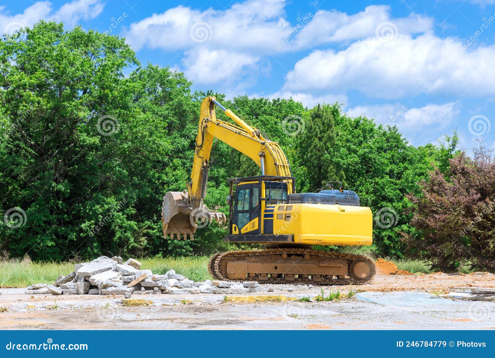 Backhoe Excavator Scoop Loading from Building the Construction Debris ...