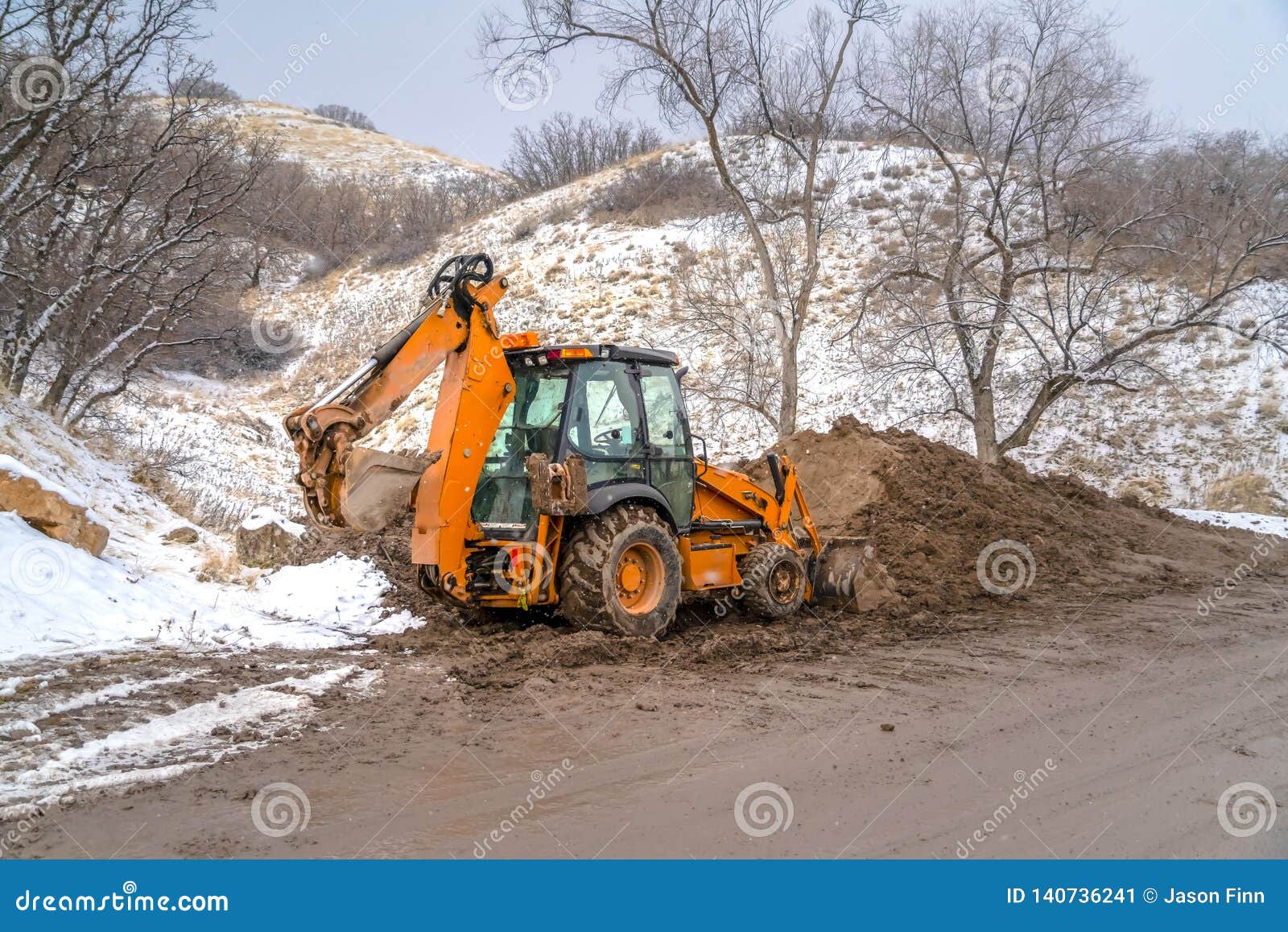 Backhoe Loader Against Snowy Hill and Trees Stock Image - Image of ...