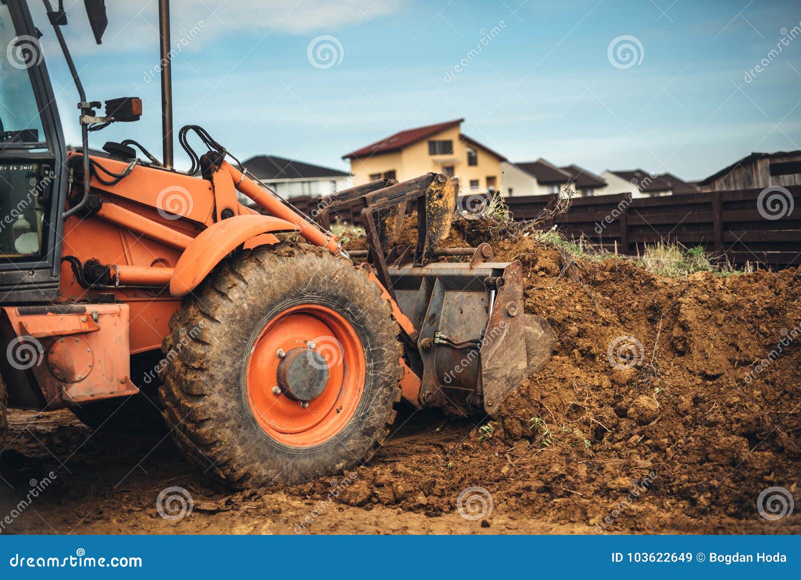 Backhoe Loader Close Up. Portrait of Engineer Leveling Earth and Soil ...