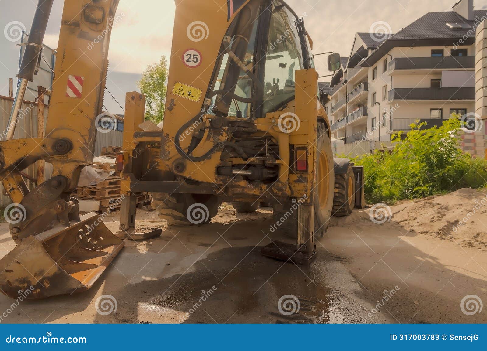 A Backhoe Loader on a Construction Site on a June Afternoon . Stock ...