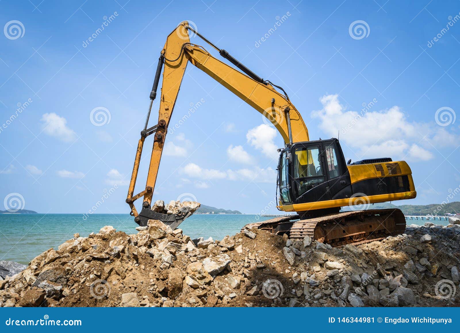 Excavator In A Stone Extraction Mine To Transform Into A Gravel Royalty ...