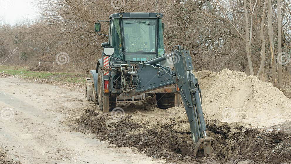 Backhoe Loader Digging Hole, Road Works. Stock Photo - Image of digging ...