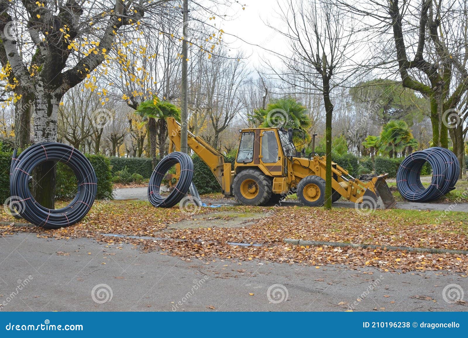 Backhoe Loader and Flexible Drain Pipes Stock Photo - Image of ...