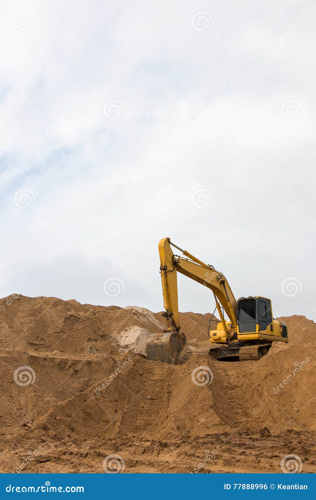 Backhoe on the sand track. stock photo. Image of machine - 77888996