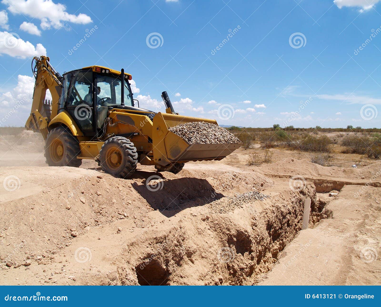 Backhoe Shoveling Gravel stock image. Image of dirt, team - 6413121