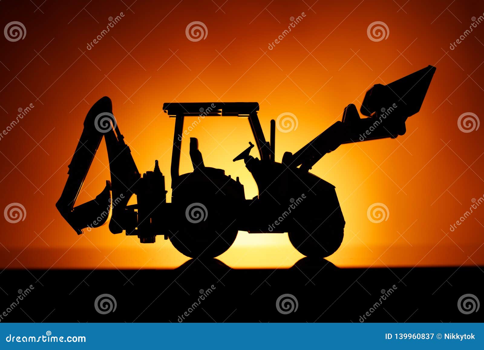 Backhoe Tractor Silhouette, Orange Background Royalty-Free Stock Photo ...