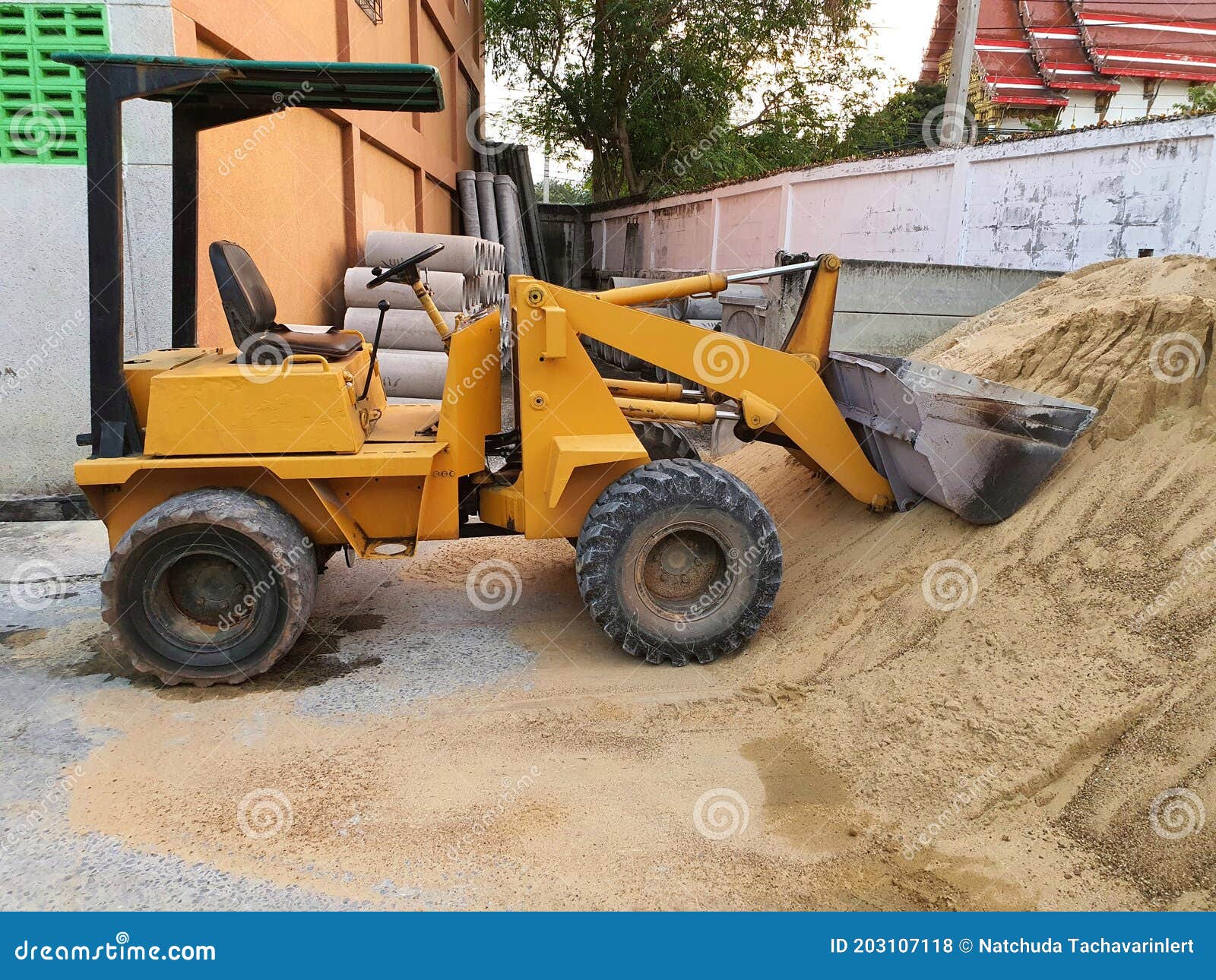 The Backhoe is Used for Loading Rocks, Soil or Sand in Construction or ...