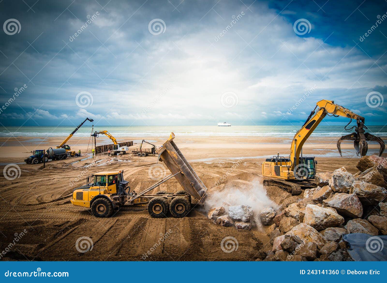 Large Hydraulic Excavators and Dumpers Working As a Team on a ...