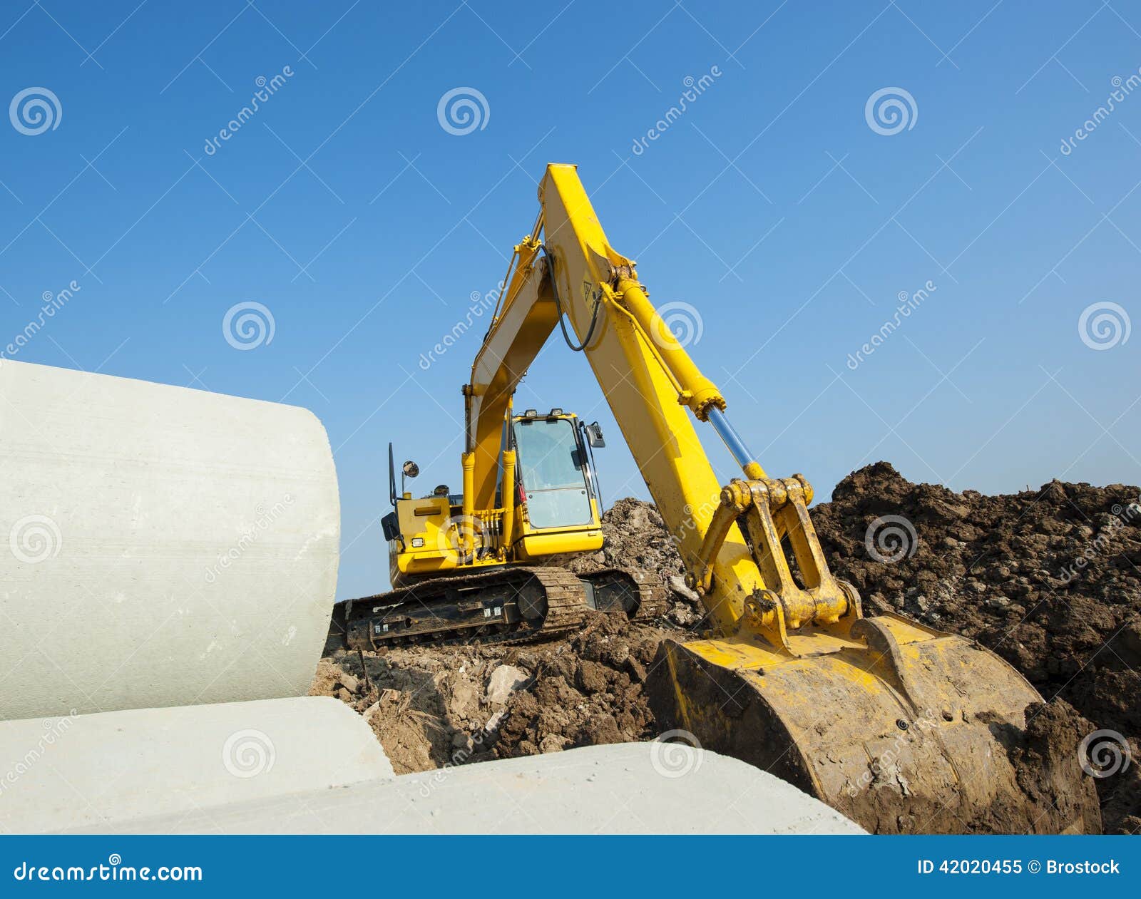 Backhoe Working By Digging Soil At Construction Site And Loading To The ...