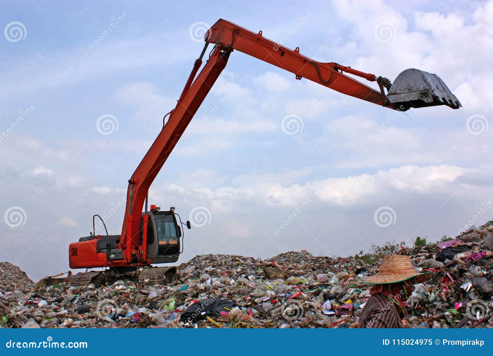 Backhoe Working on Garbage Dump at Landfill. People Working at a ...