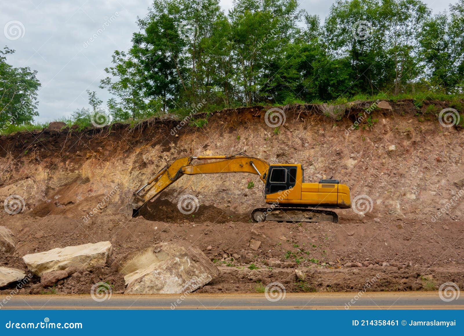 Backhoe Working on Hill Side Road Stock Image - Image of road, gravel ...