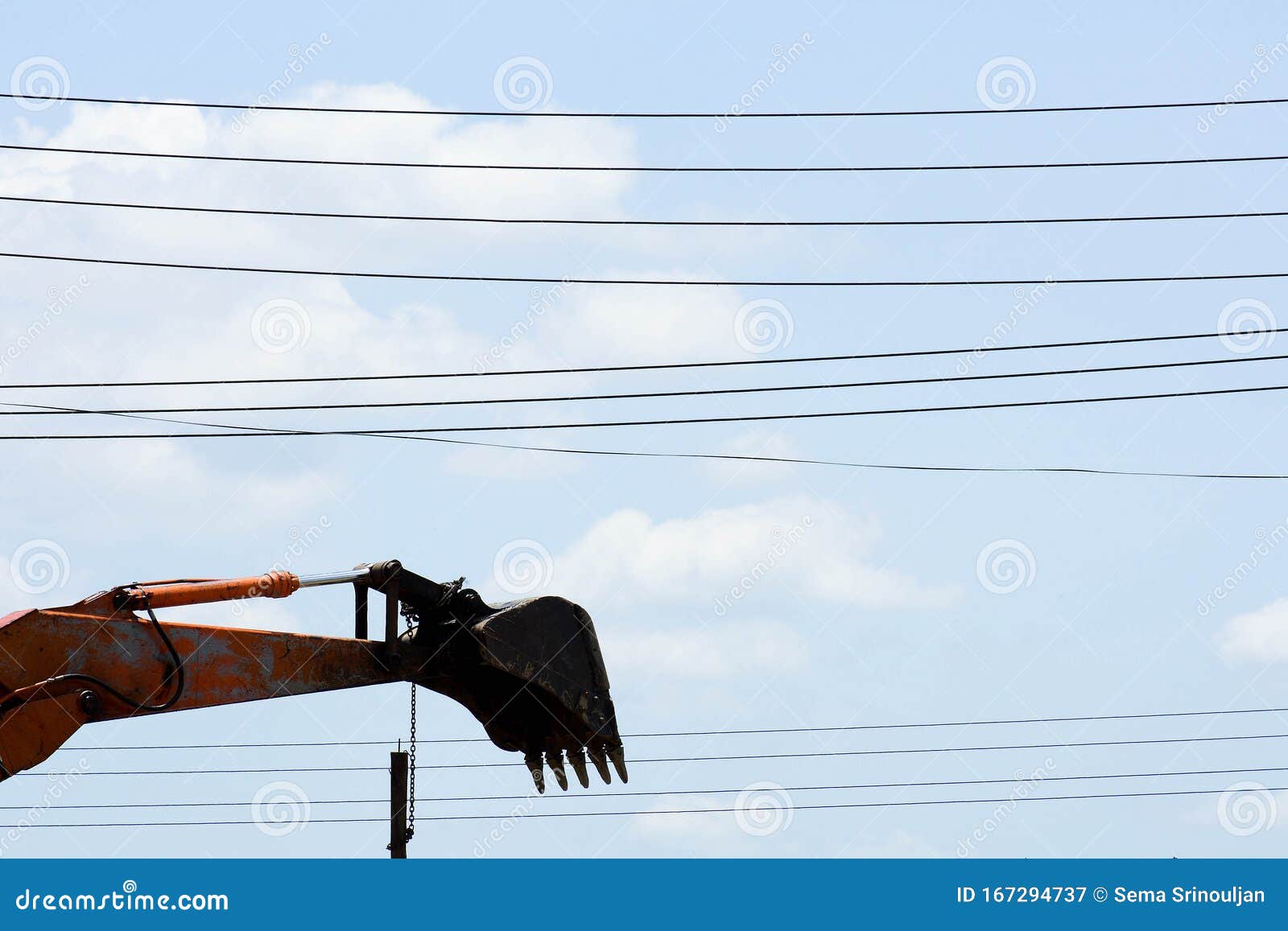 Backhoe is Working Near the Cable Wire. Stock Image - Image of loader ...