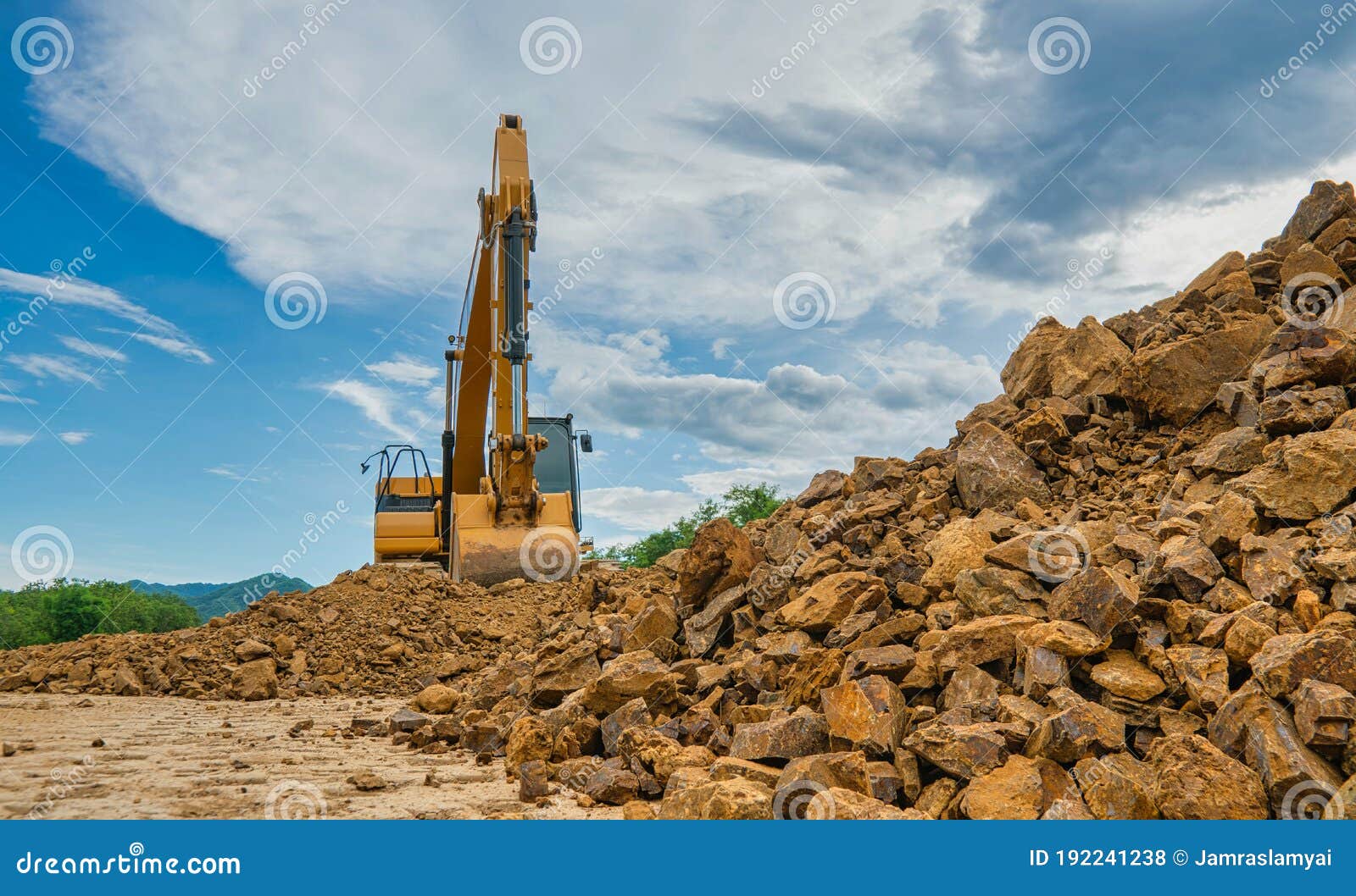Backhoe is Working on Pile of Stones Stock Photo - Image of countryside ...