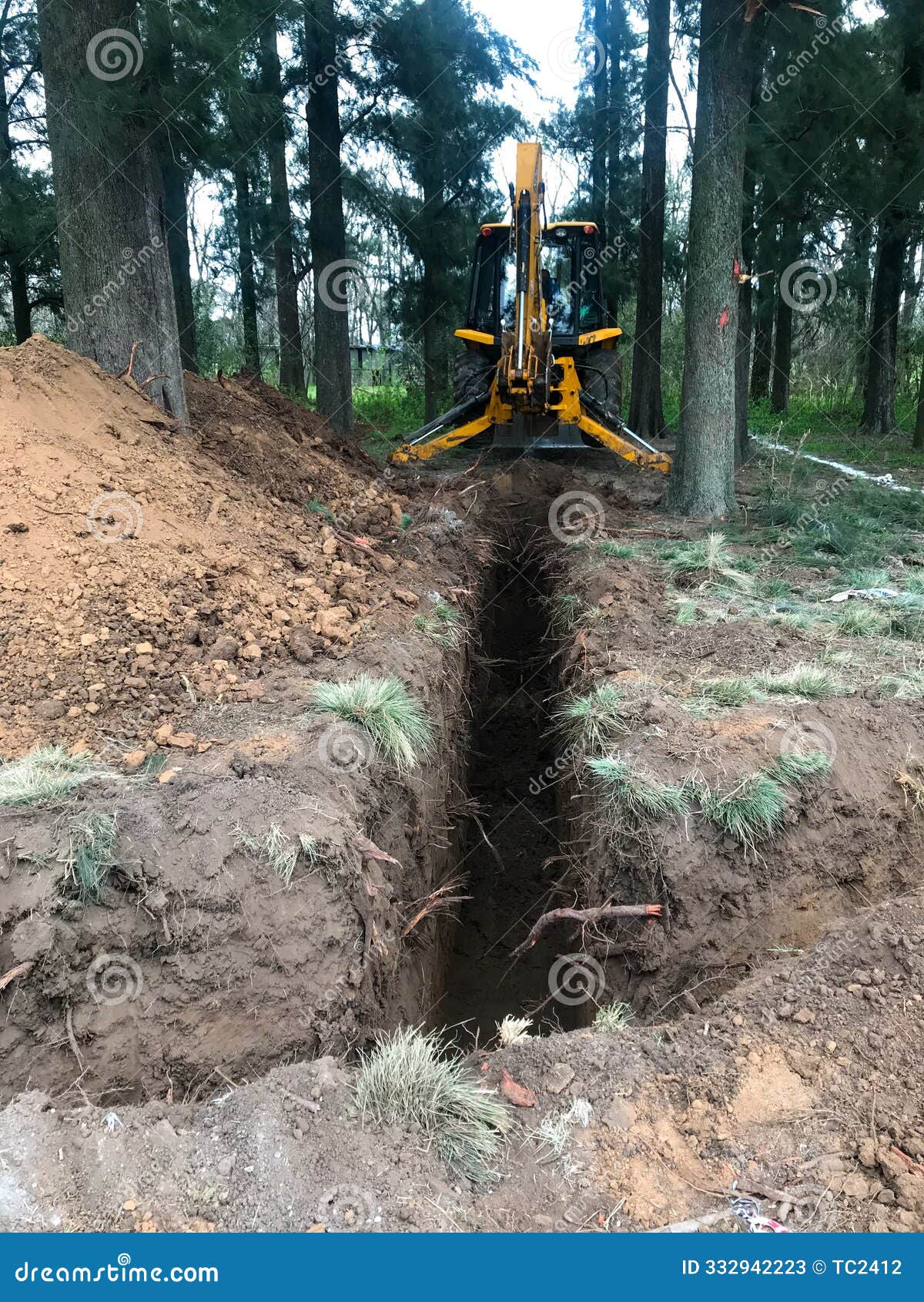 Backhoe Working By Digging Soil At Construction Site And Loading To The ...