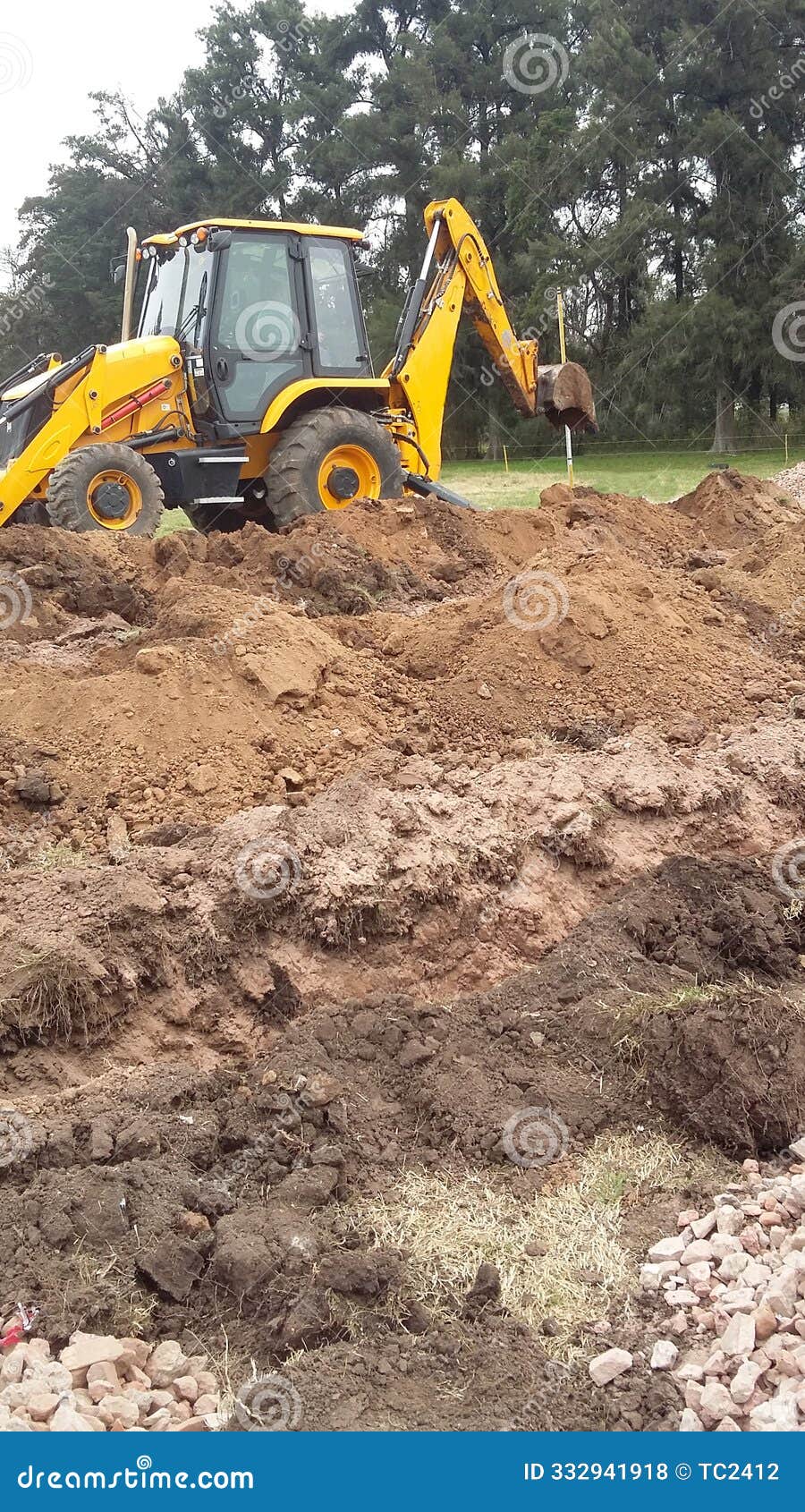 Backhoe Working By Digging Soil At Construction Site. Bucket Of Backhoe ...