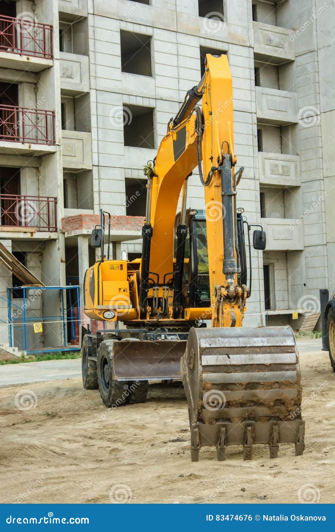 Backhoes Standing at Construction Site Stock Photo - Image of loader ...