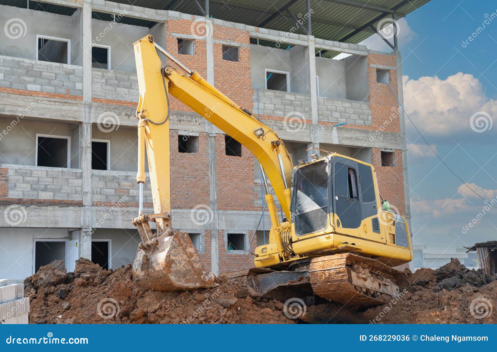 Backhole Loader Digging Drainage Ditch and Laying Concrete Pipeline ...