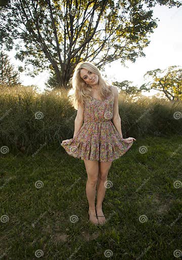 Backlit Blond in Sun Dress stock image. Image of beauty - 21578061