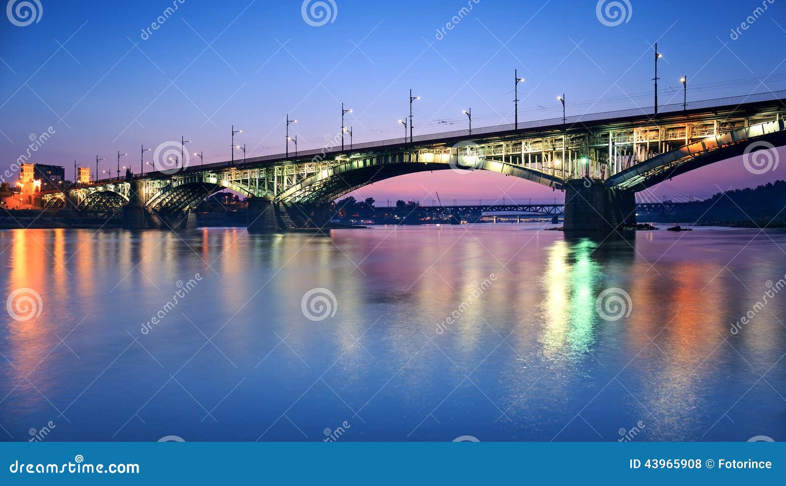 Backlit Bridge at Night and Reflected in the Water Stock Photo - Image ...