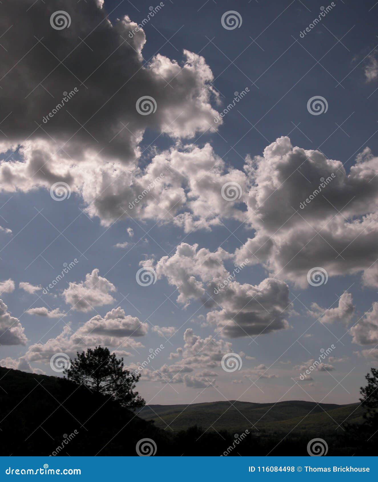 Backlit Clouds with Trees and Hills Stock Photo - Image of landscape ...