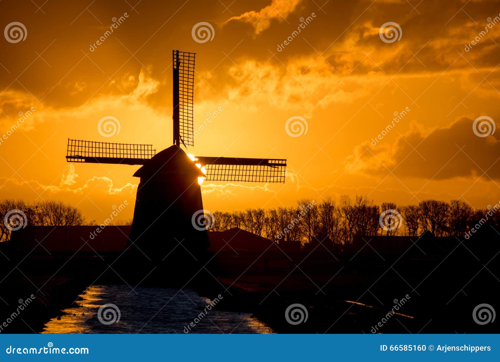 Backlit Dutch Windmill during Sunrise Stock Photo - Image of ...